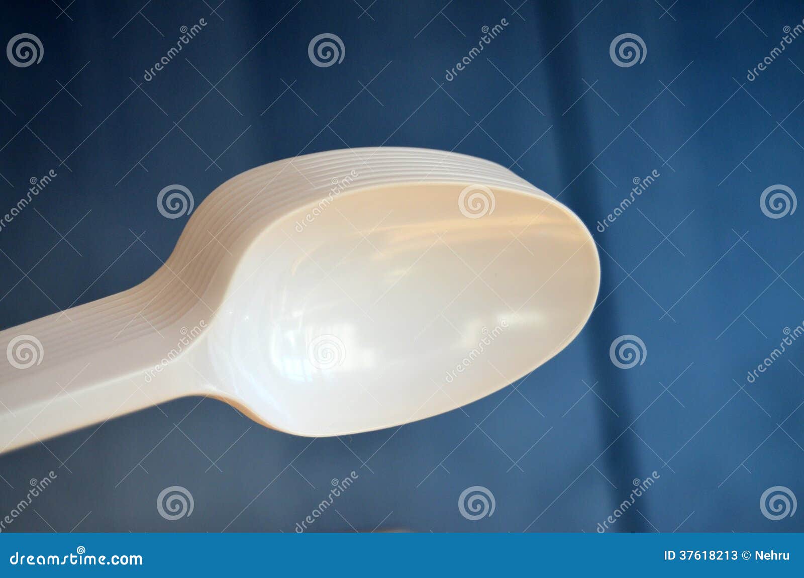 White plastic spoons stock image. Image of macro, simplicity - 37618213