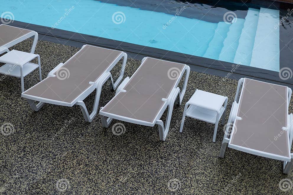 White Plastic Sunbeds by the Pool Stock Image - Image of heat, leisure ...