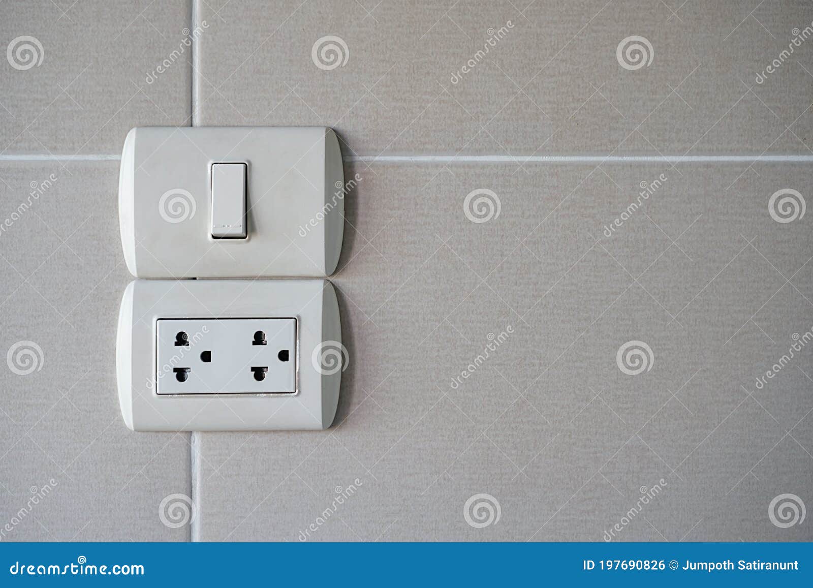 White Plastic Switch and Plug on Ceramic Tile Wall in Bathroom. Stock ...