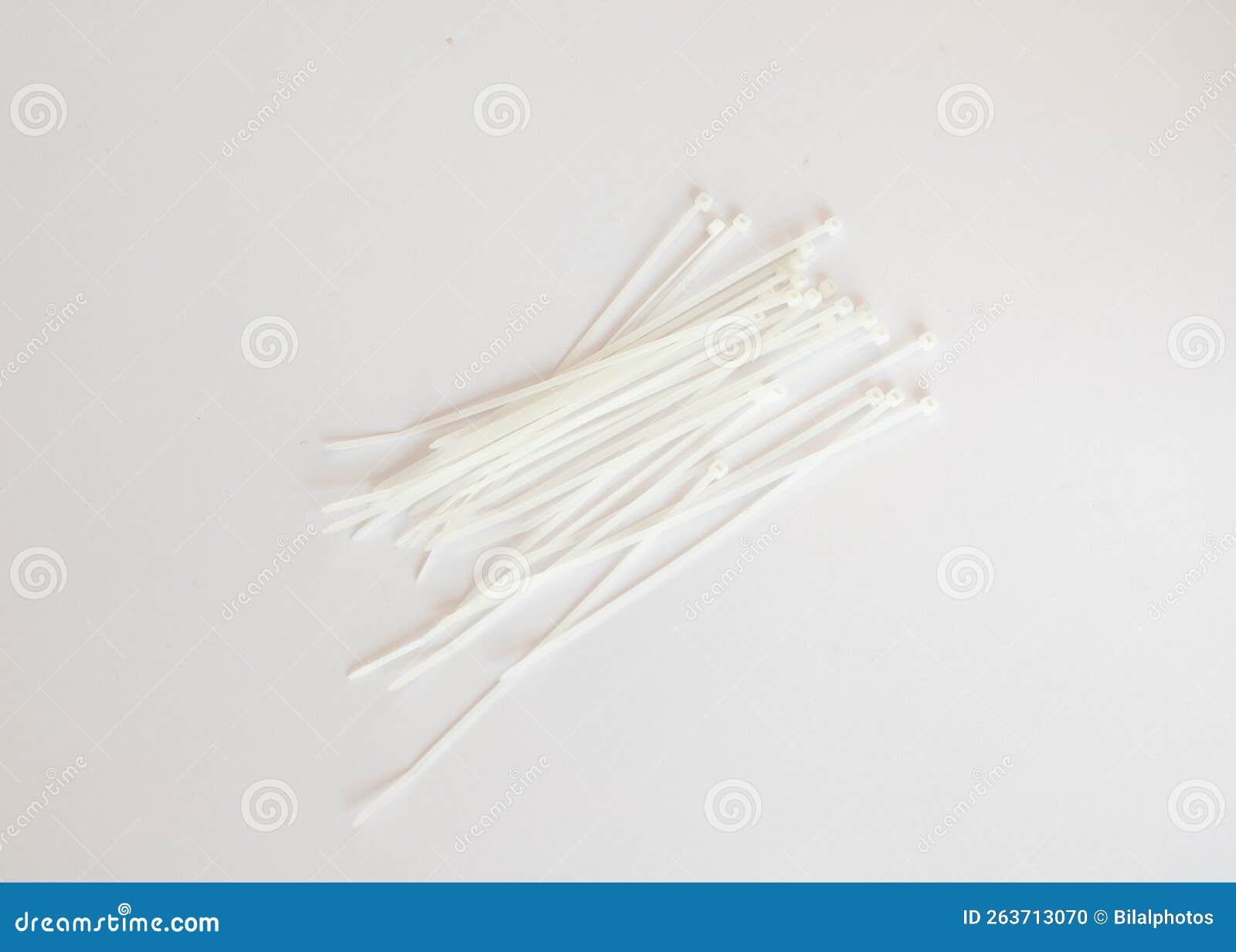 White Plastic Ties on White Isolated Background Stock Photo - Image of ...