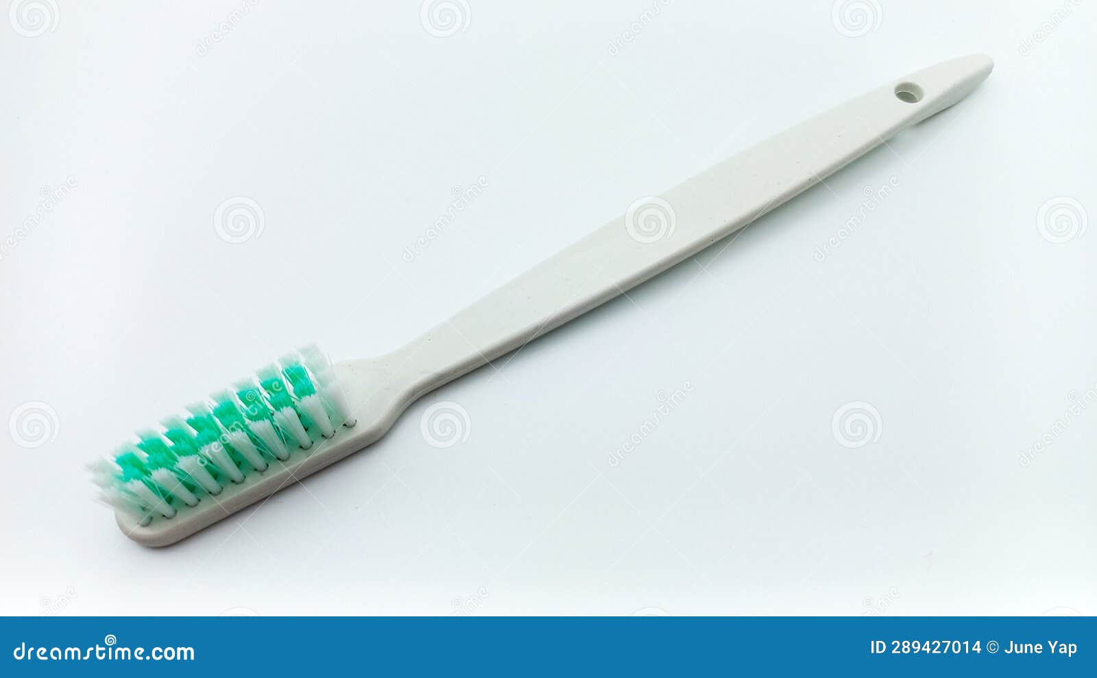 White Plastic Toothbrush Isolated on White Background. Tilted View from ...