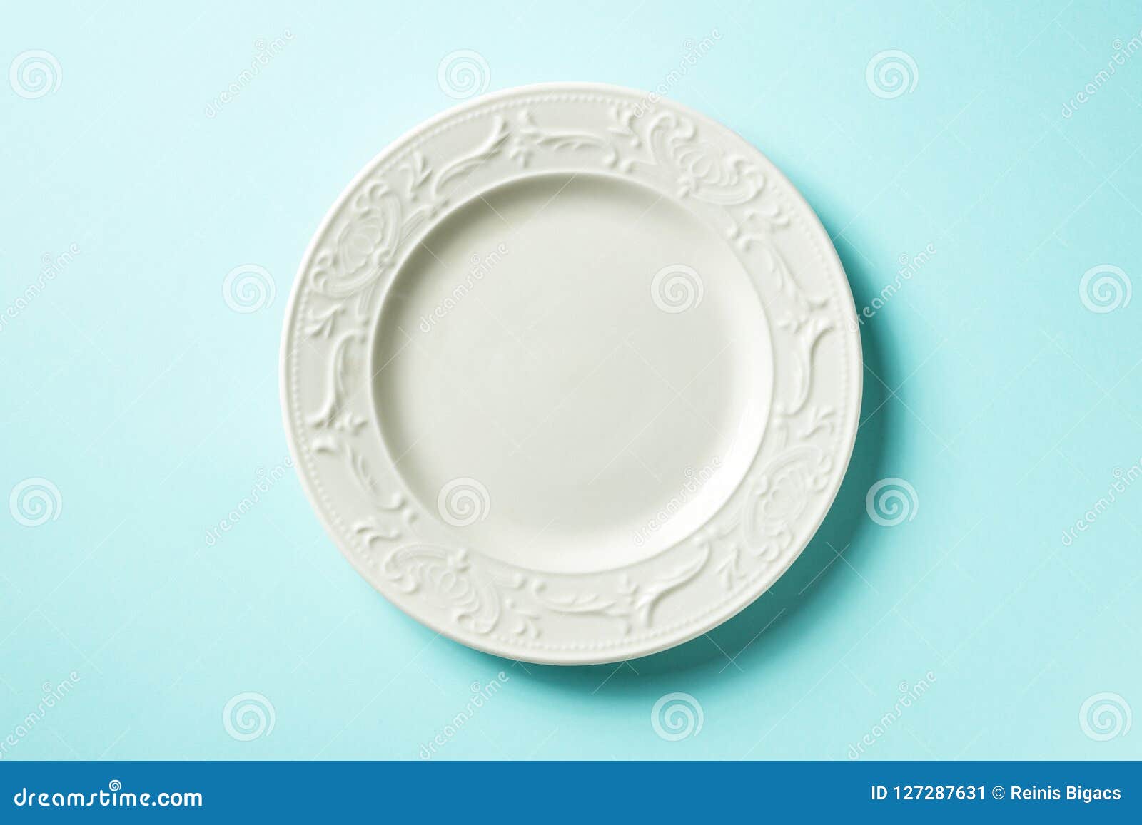 White Plate on Blue Background, from Above Stock Image - Image of ...