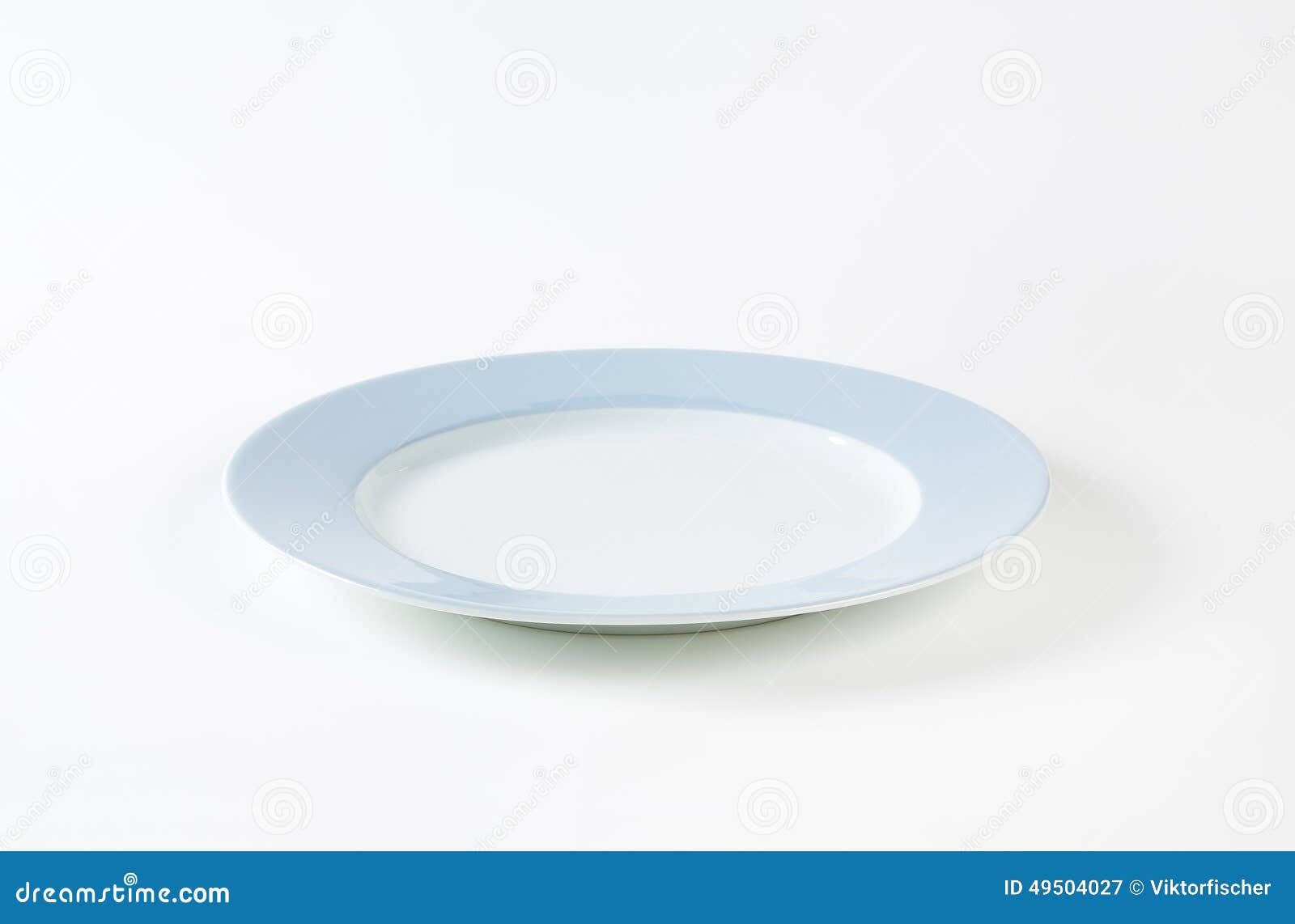 White plate with blue rim stock image. Image of single - 49504027