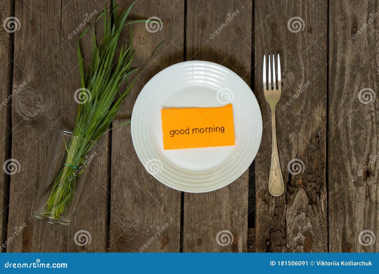 White Plate a Bunch of Green Grass and a Fork on the Table and Next ...