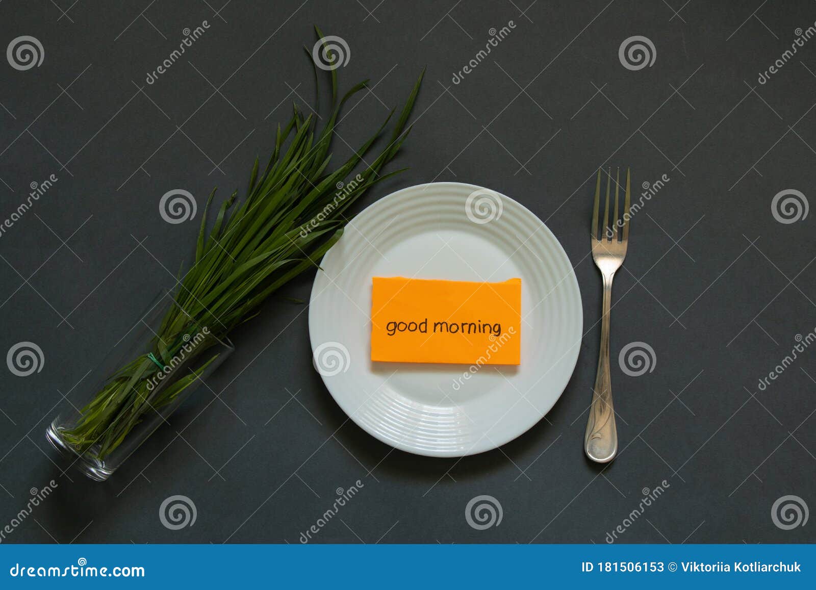 White Plate a Bunch of Green Grass and a Fork on the Table and Next ...