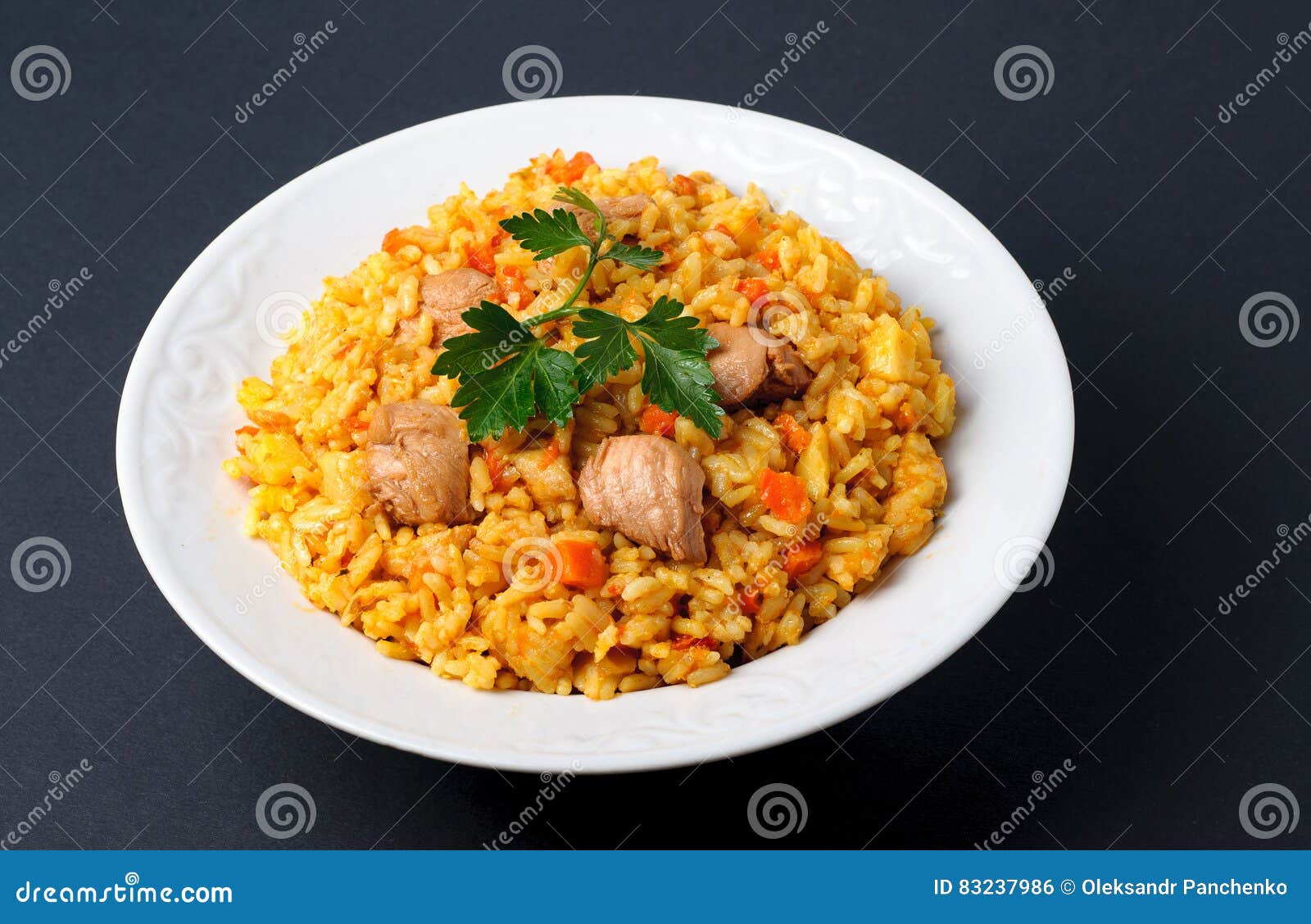 White Plate of Cooked Rice with Meat on Dark Background Stock Photo ...