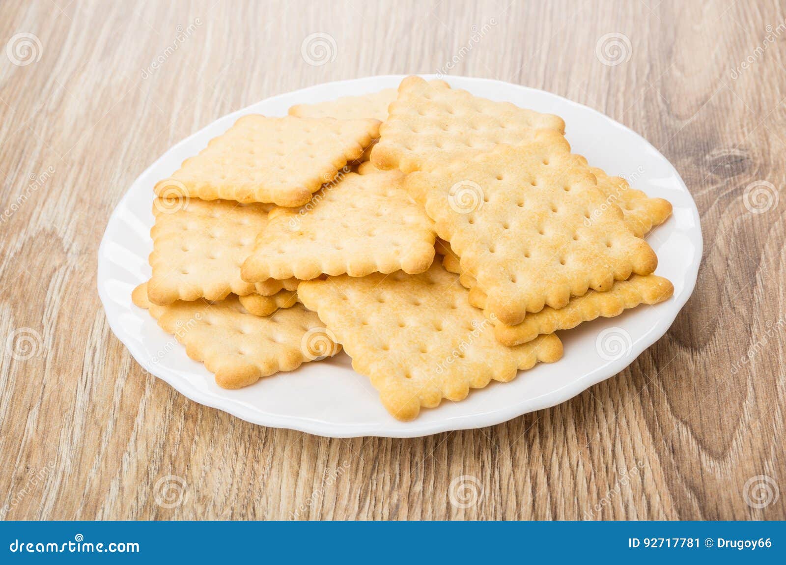 White Plate with Rectangular Crackers on Table Stock Image - Image of ...