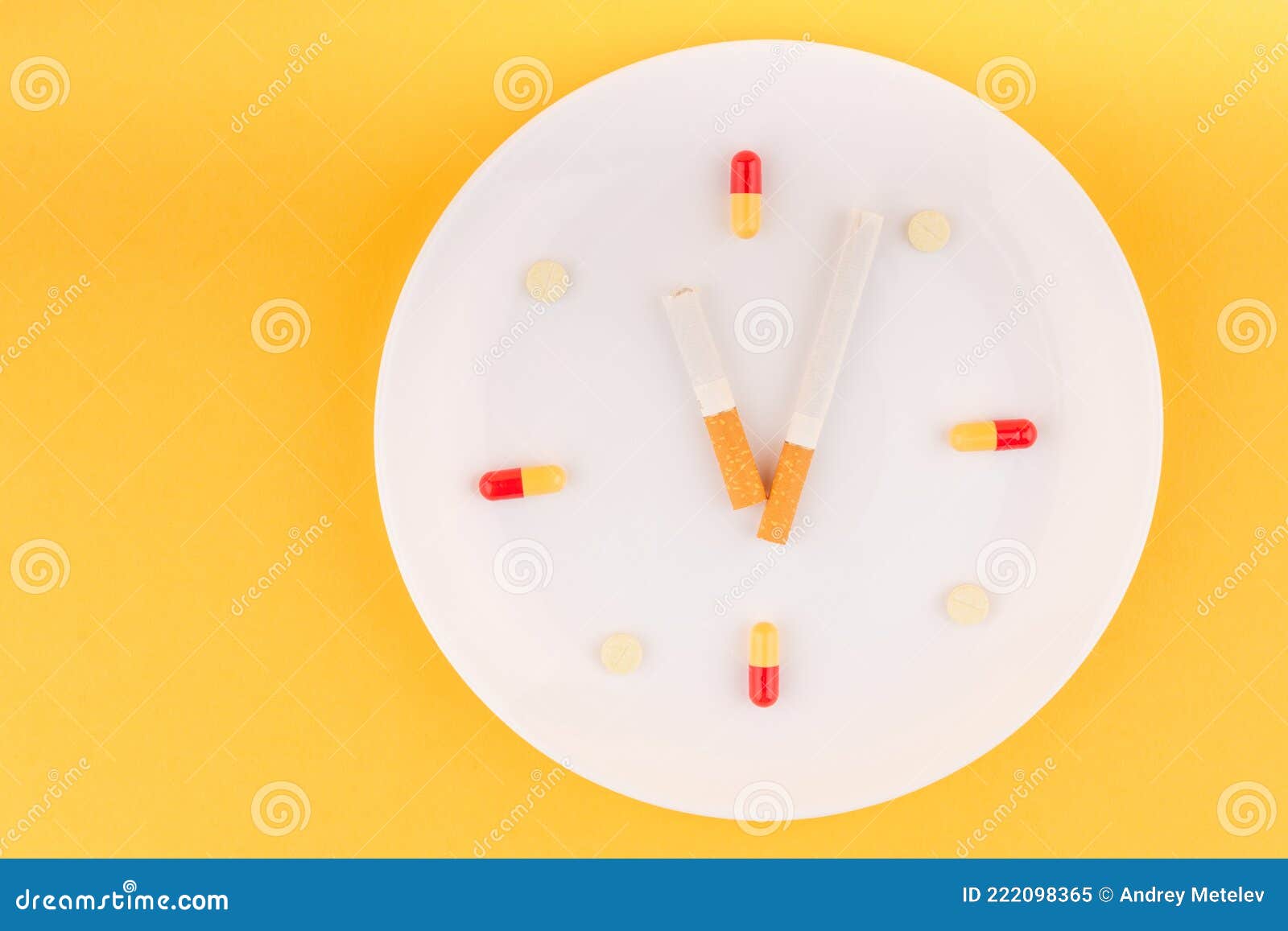 On a White Plate There are Cigarettes in the Form of Clock Hands, the ...