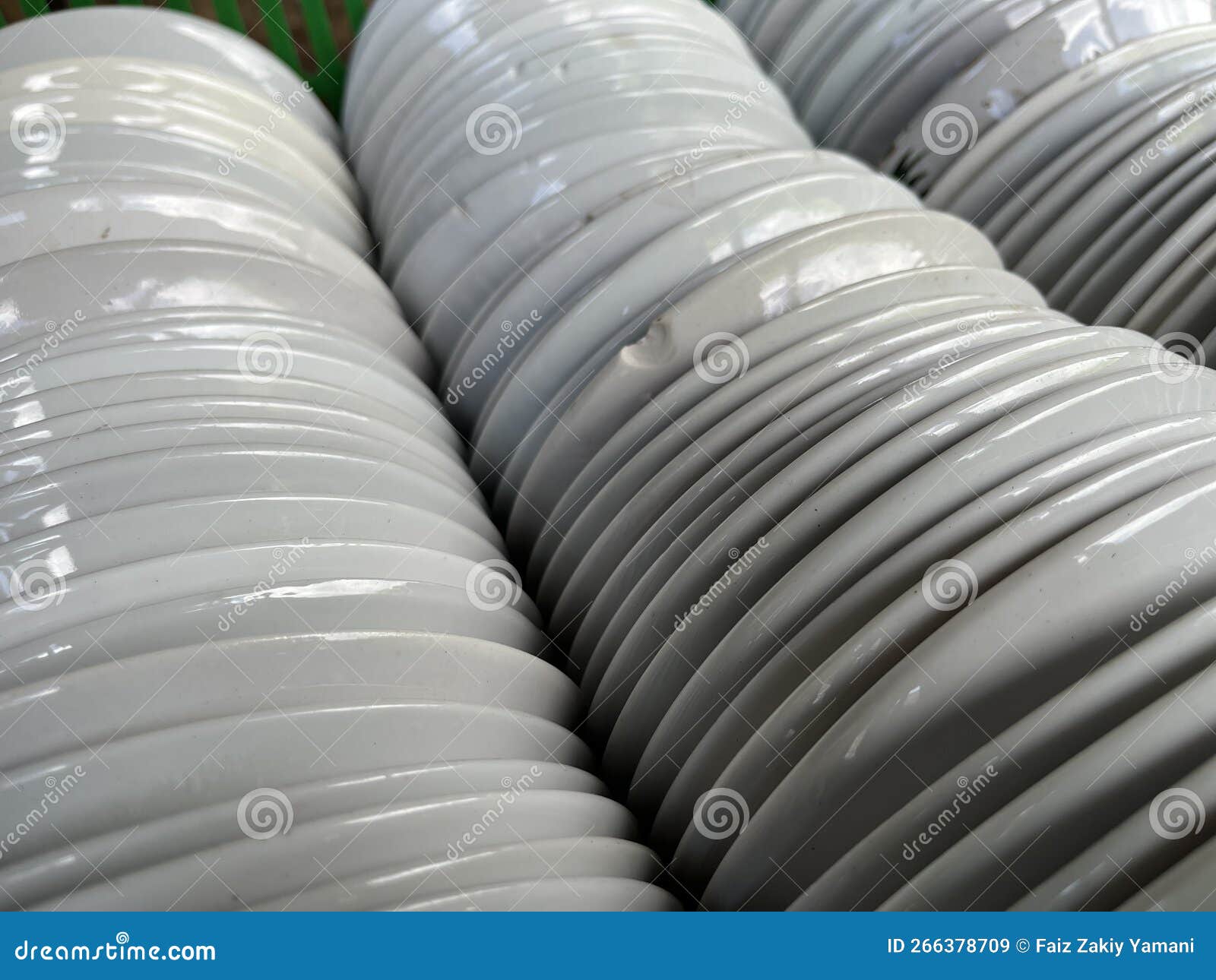 White Plates Being Stacked Together in a Plastic Basket. Stock Image ...