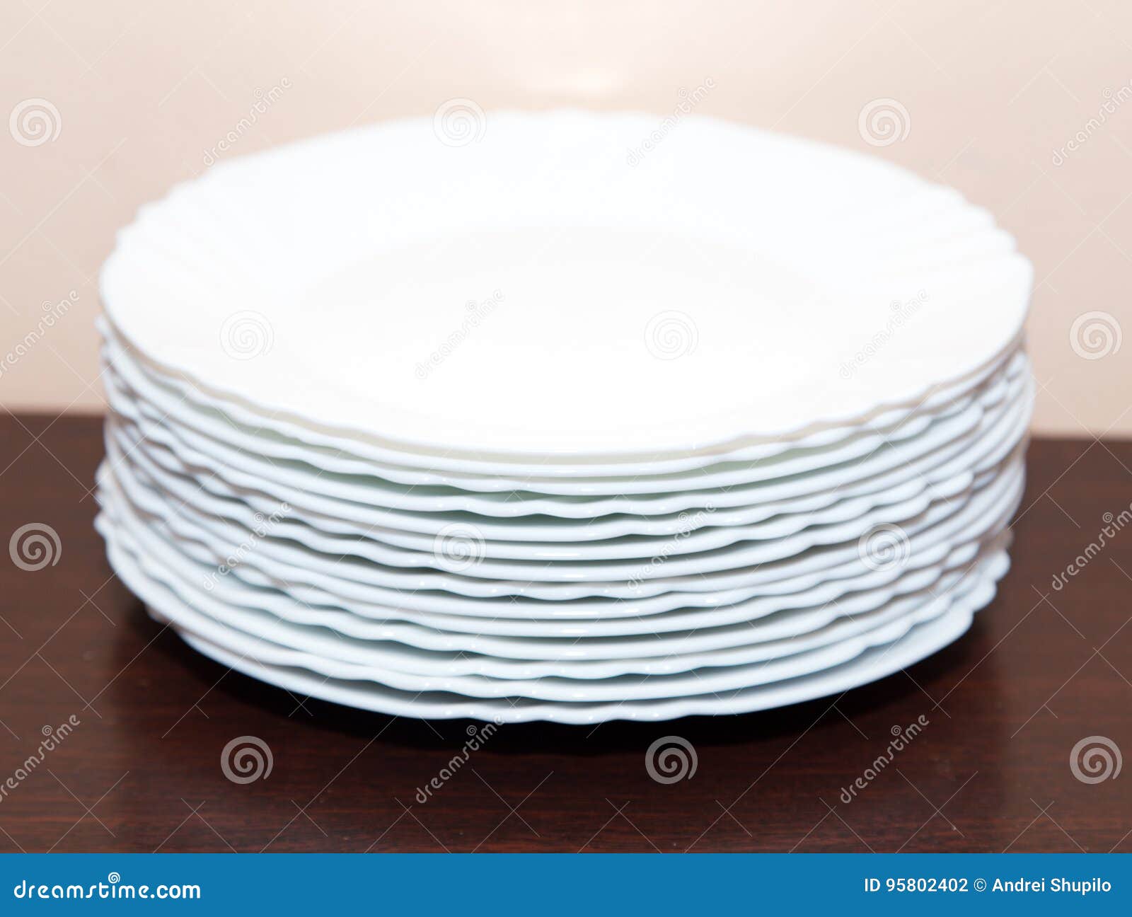 White plates on the table stock photo. Image of ceramic - 95802402