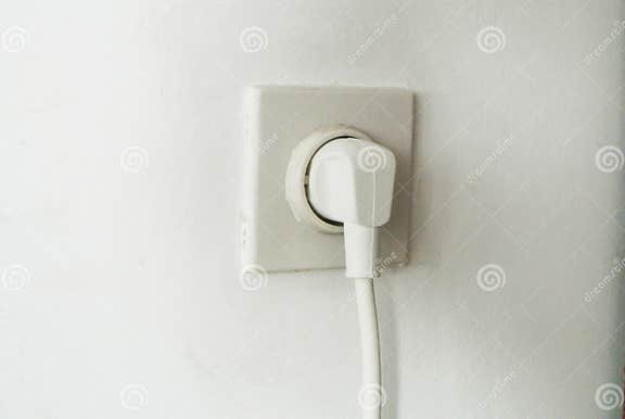 White plug in wall socket stock photo. Image of plug - 152406930