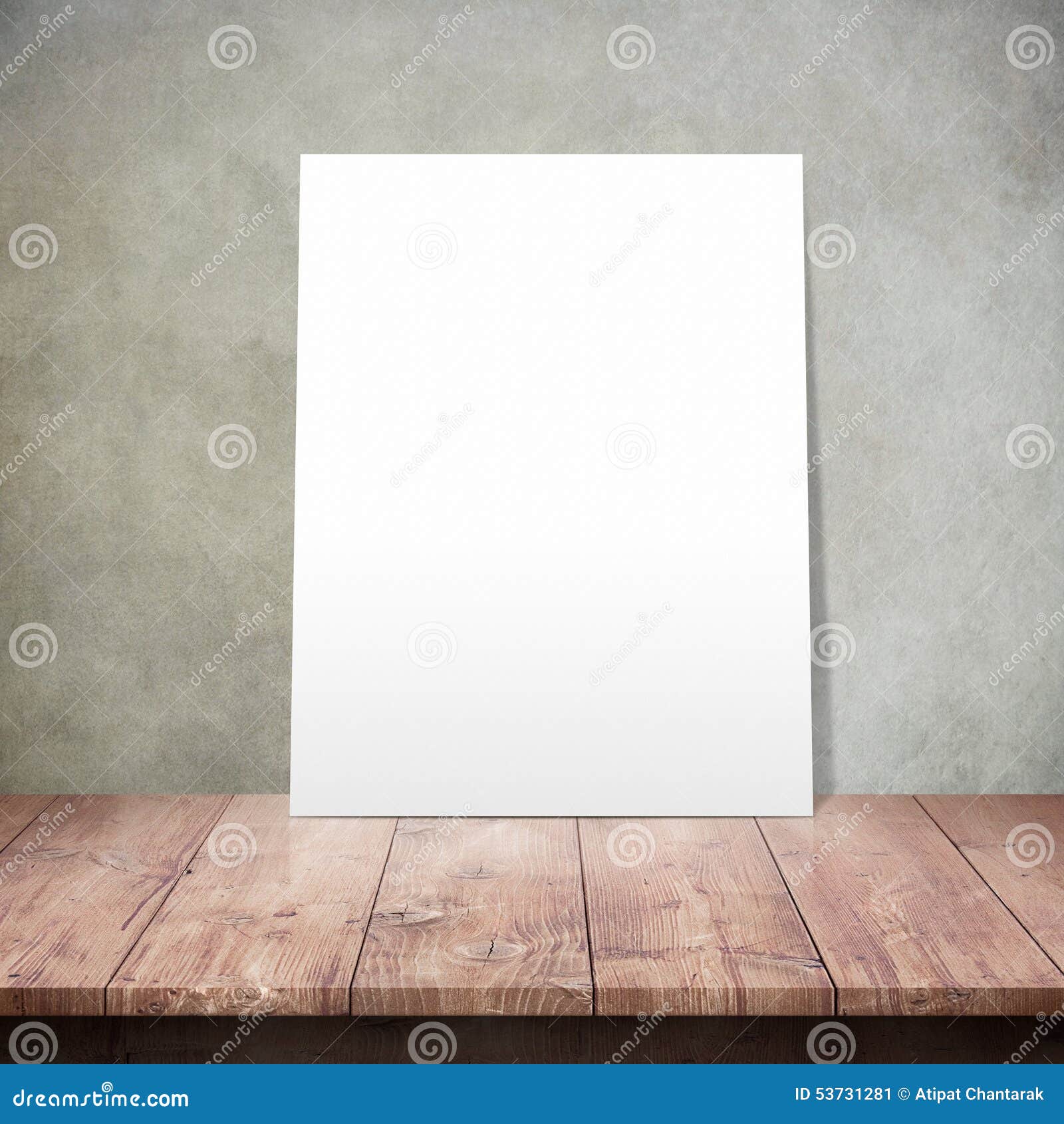 White Poster on a Wooden Table with Concrete Wall Background Stock ...