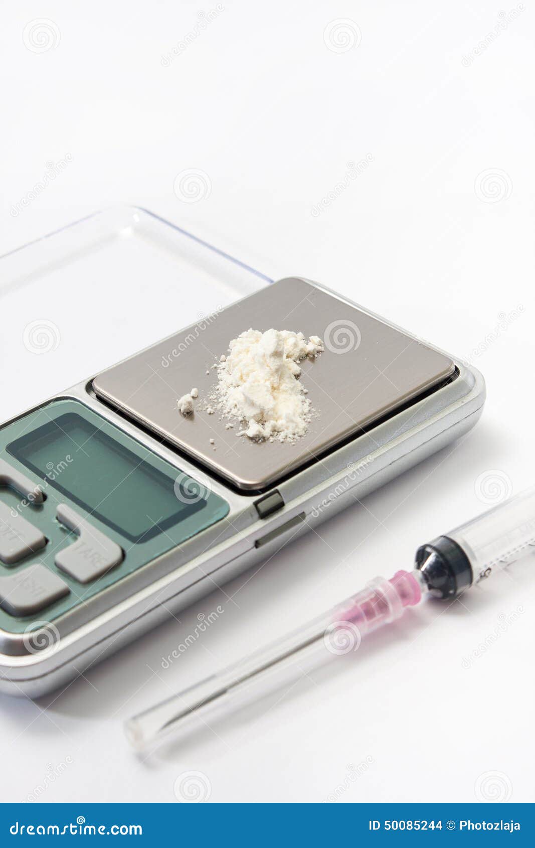 White Powder and Syringe with Needle on a Digital Scale Stock Photo ...