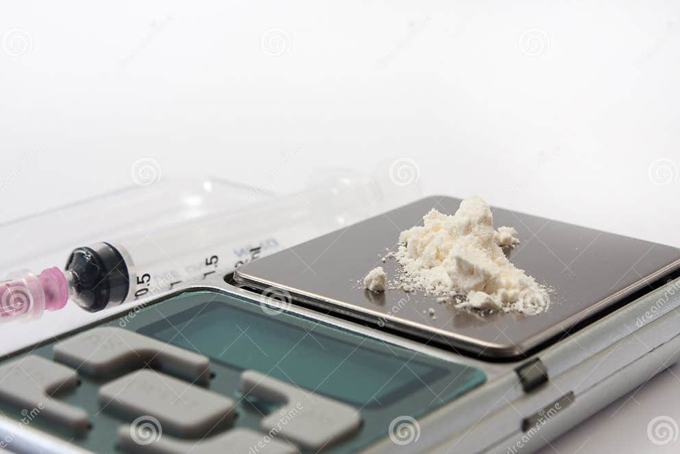 White Powder and Syringe with Needle on a Digital Scale Stock Photo ...