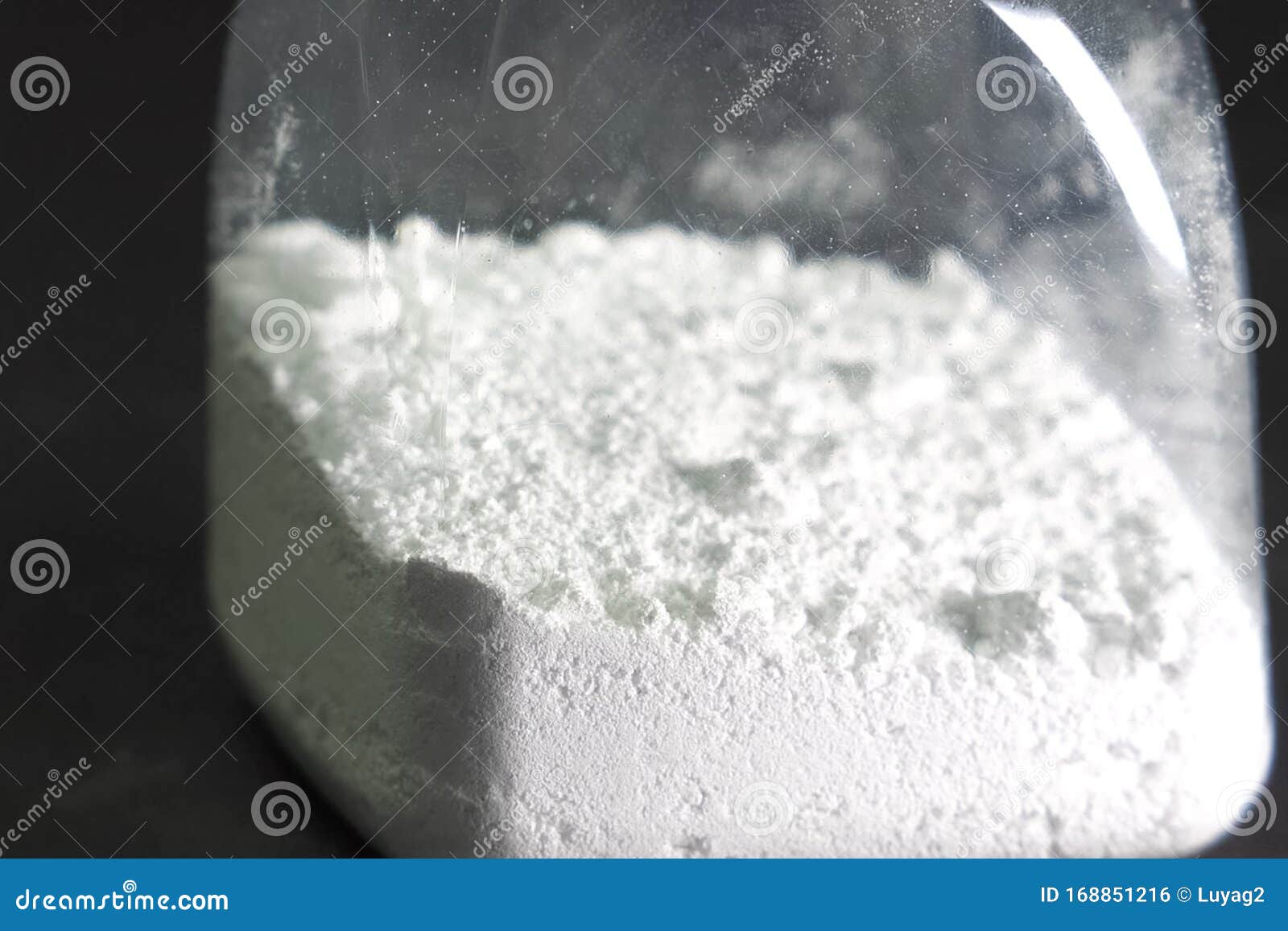 White Powder in Transparent Jar. White Powder on the Table Stock Photo ...