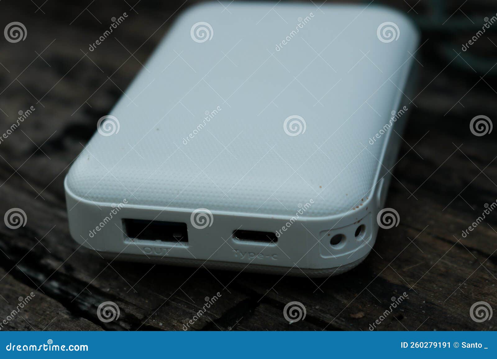 White Power Bank Electronic with Plug on Wooden Table Stock Image ...