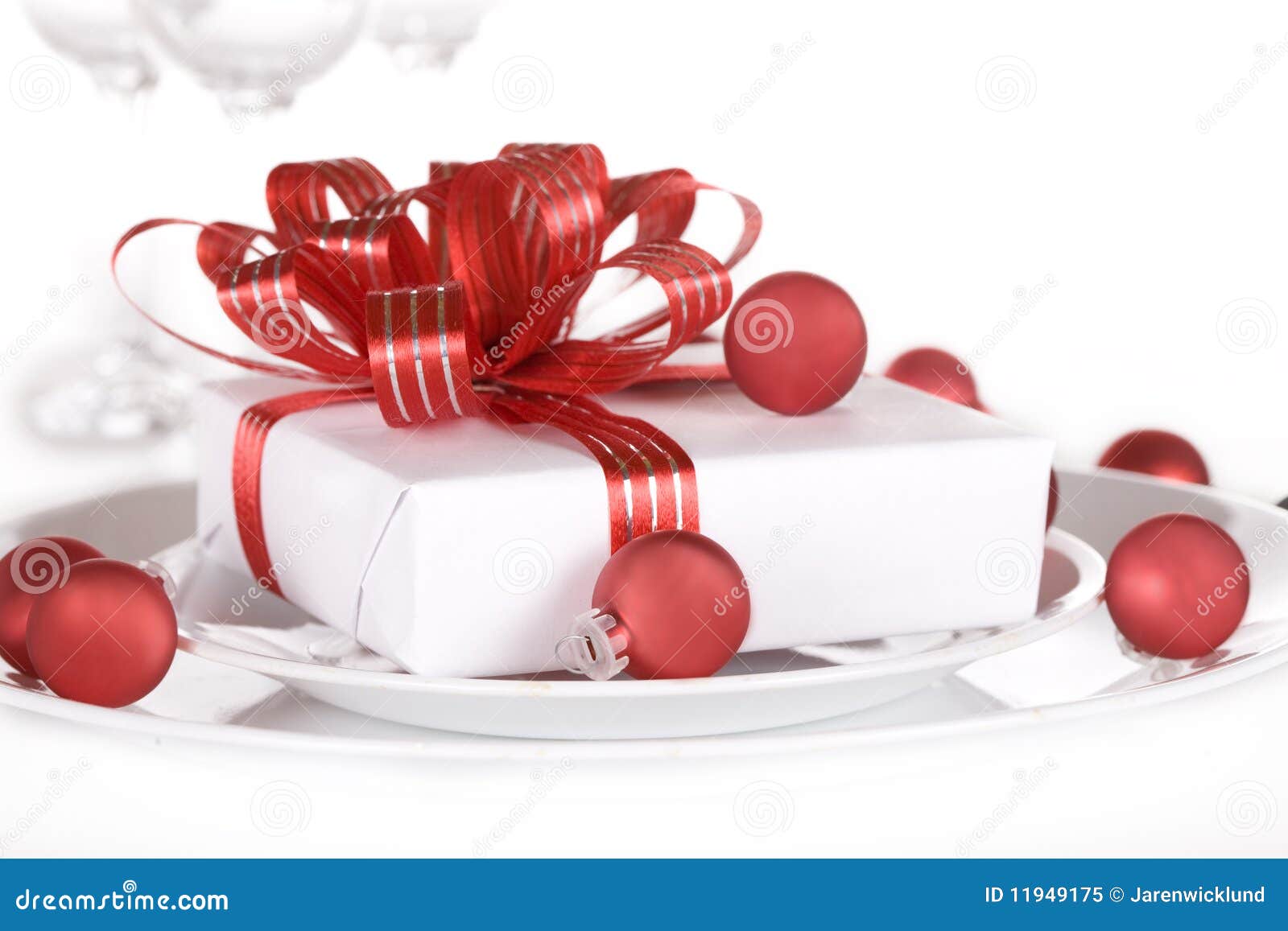White Present with Red Ribbons on a Dinner Plate Stock Image - Image of ...