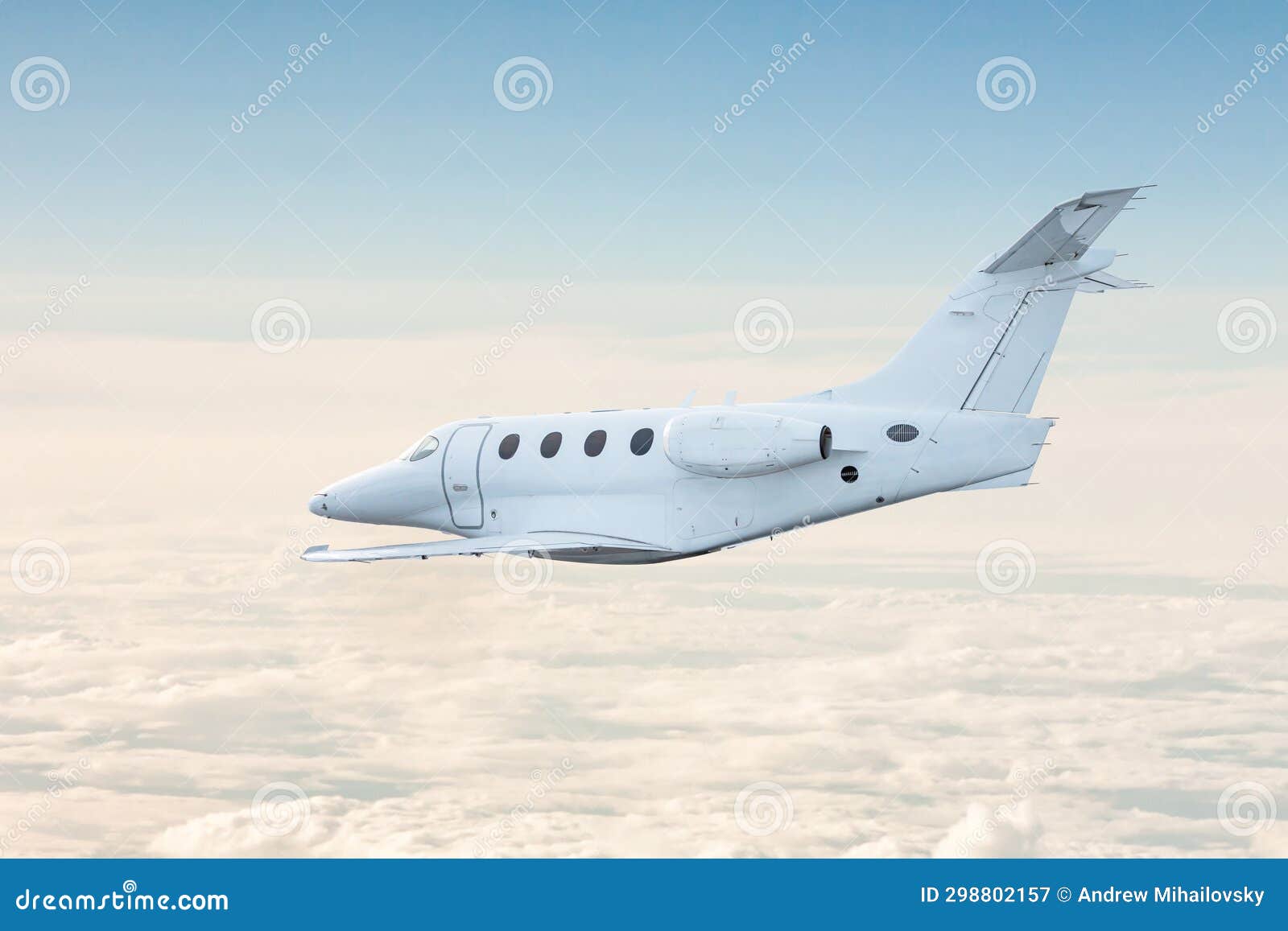 White Private Jet Fly in the Air Above the Clouds Stock Image - Image ...
