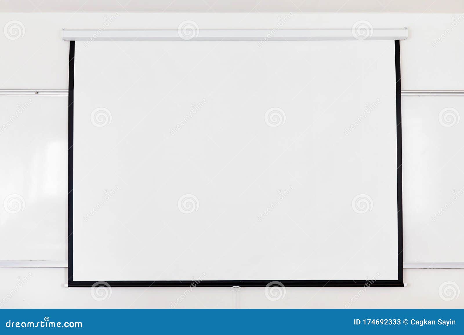 White Projection Screen Over a White Board on the Classroom Wall Stock ...