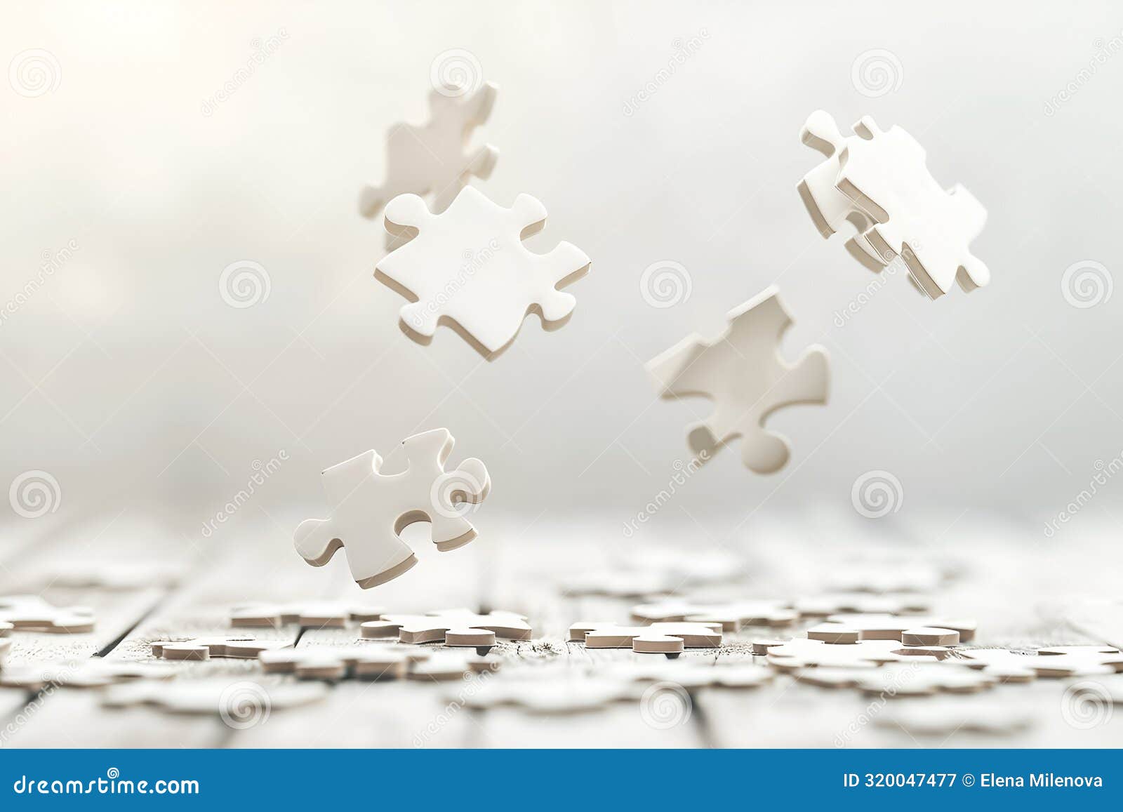 White Puzzle Falling On Table With Interlocking Pieces Symbolizing Connection Stock