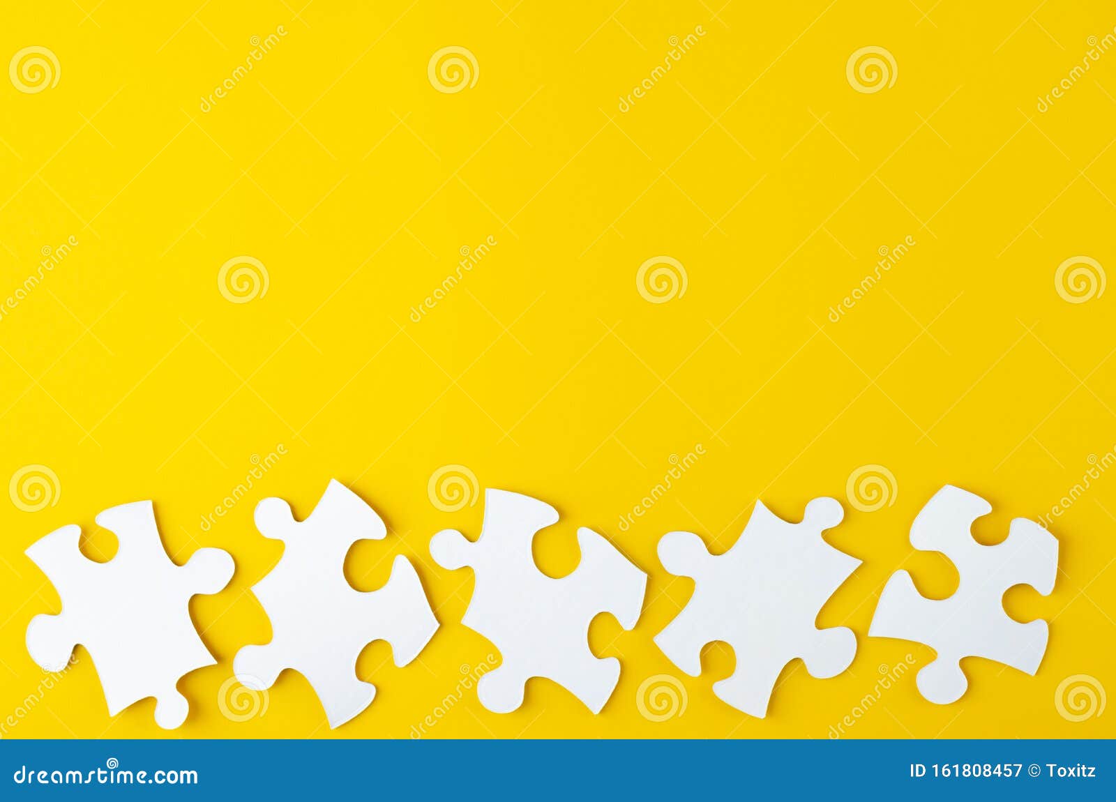 White Puzzles Composition on Yellow Background. Flat Lay Stock Image ...