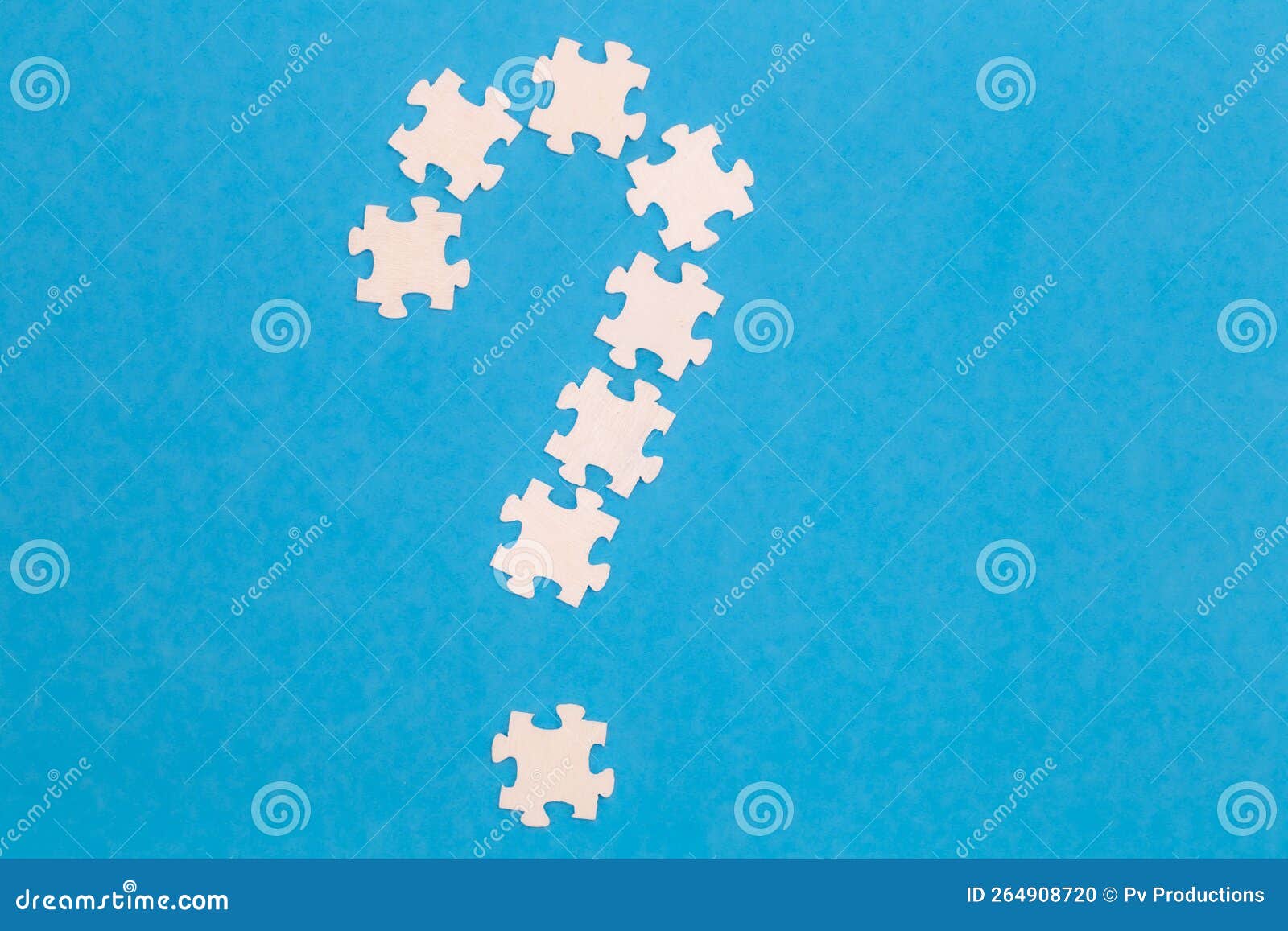 White Puzzles in the Shape of a Question Mark on a Blue Background ...