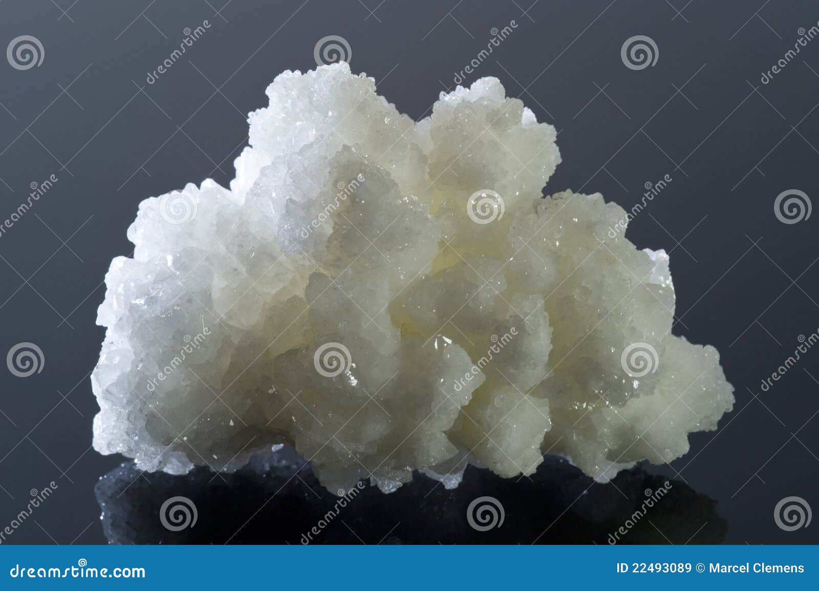 White Quartz Crystals on Reflective Black Surface Stock Image - Image ...