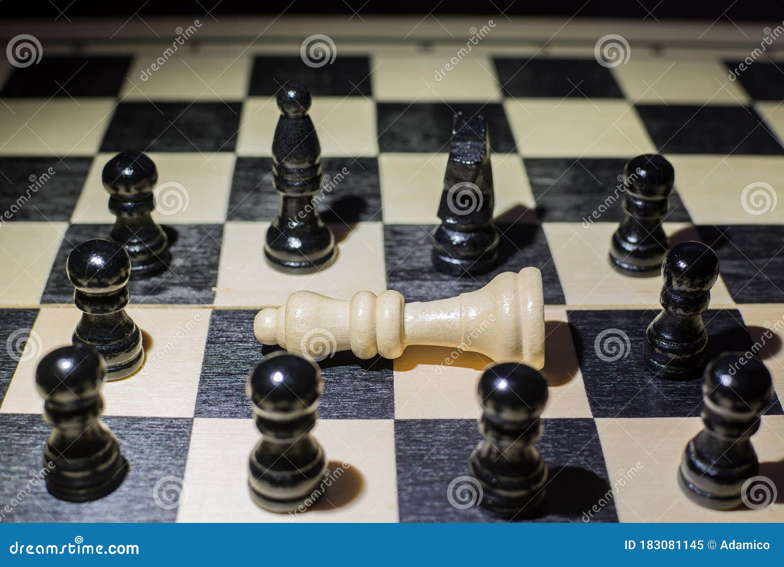 White Queen Fallen on the Chessboard and Around the Black Pieces Stock ...