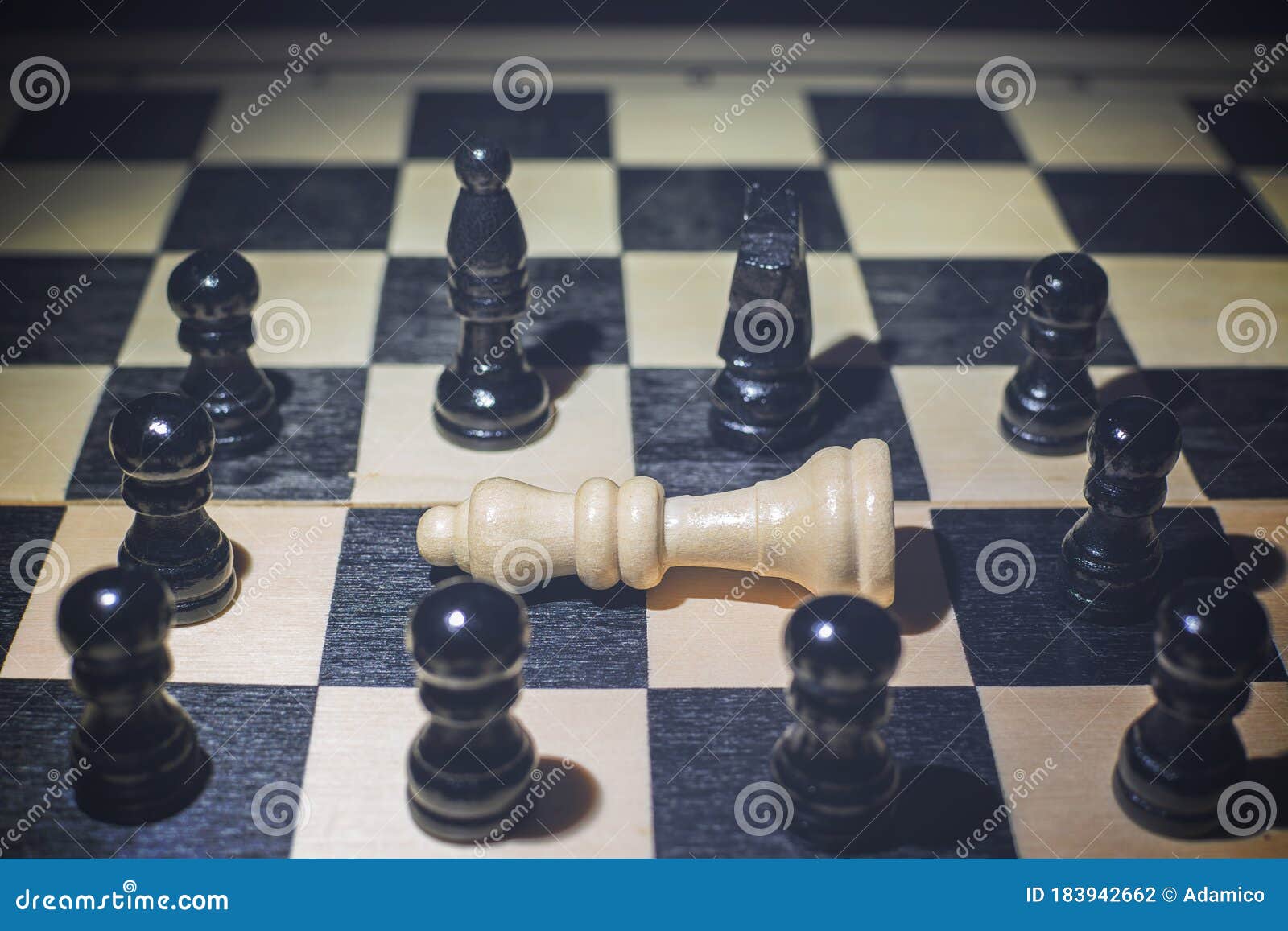 White Queen Fallen on the Chessboard and Around the Black Pieces Stock ...