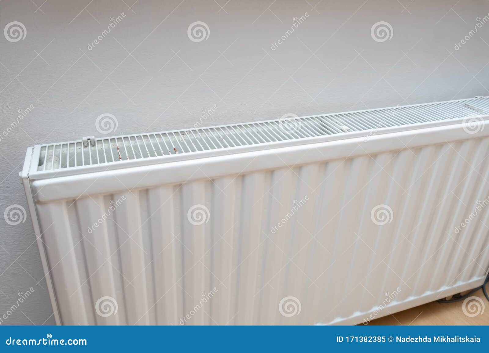 White Radiator of a Central Heating System, Warm and Cozy Home Concept ...