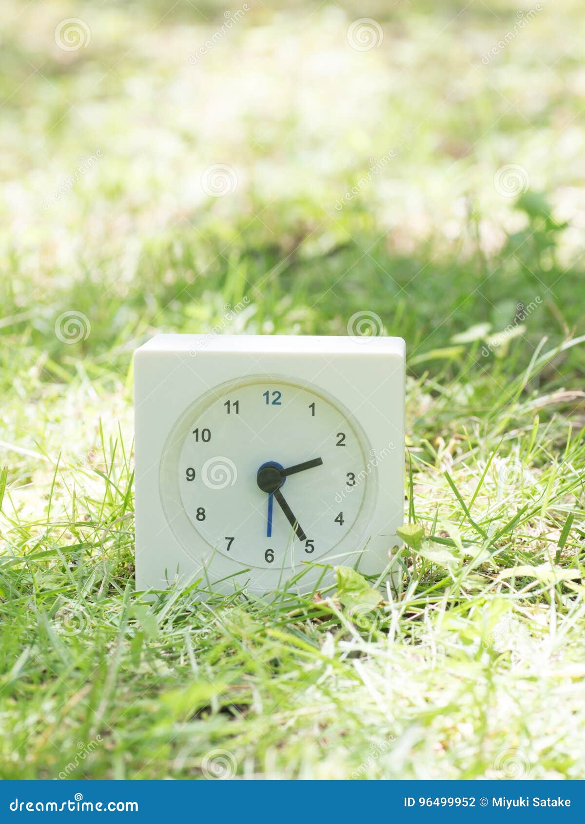White Simple Clock on Lawn Yard, 2:25 Two Twenty Five Stock Photo ...