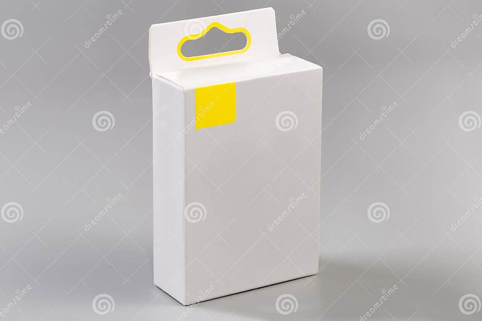 White Rectangular Cardboard Hang Tab Packing Box on Gray Surface Stock ...