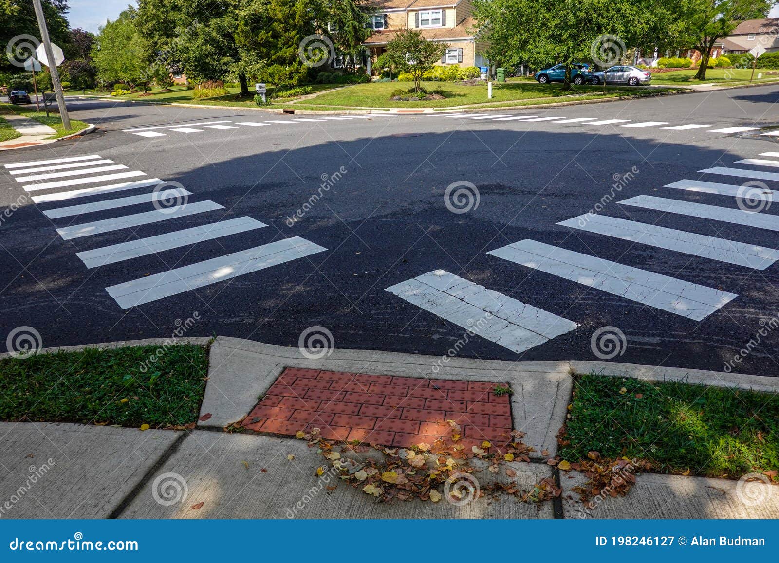 White Rectangular Intermittent Crosswalk Markers Painted on the Asphalt ...