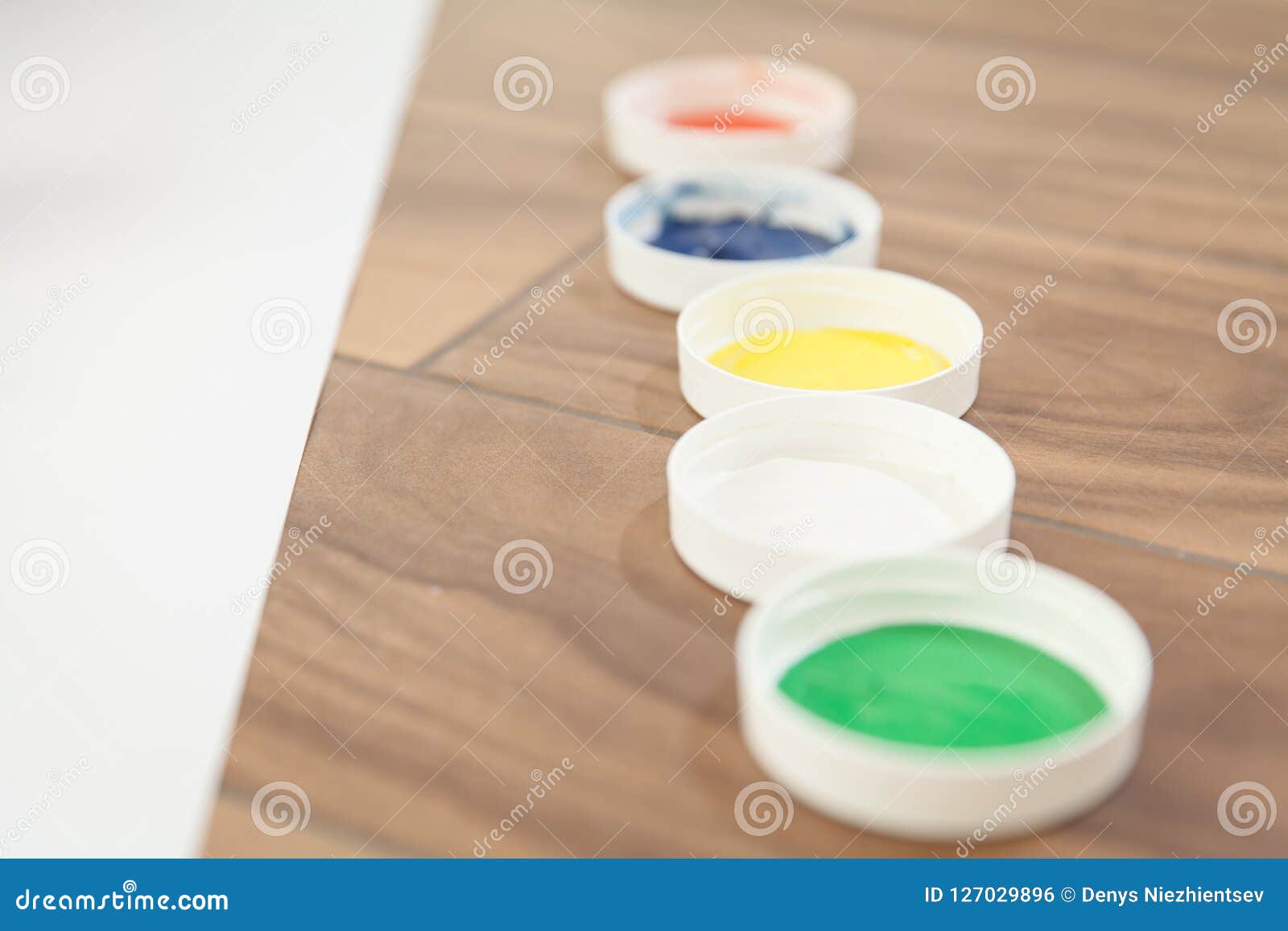 White, Red, Blue, Green and Yellow Lids from Paints. Stock Photo ...