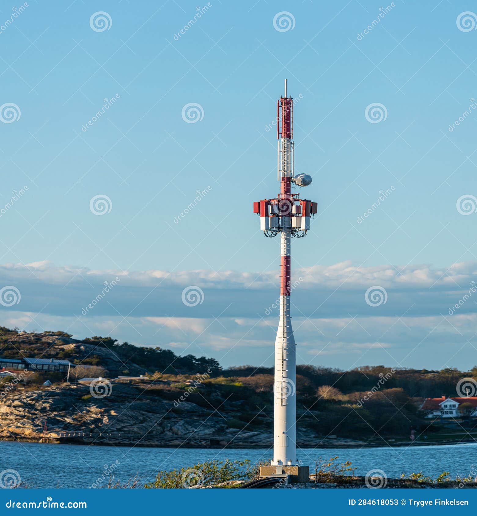 White and Red Communications Pylon by the Sea.. Stock Image - Image of ...