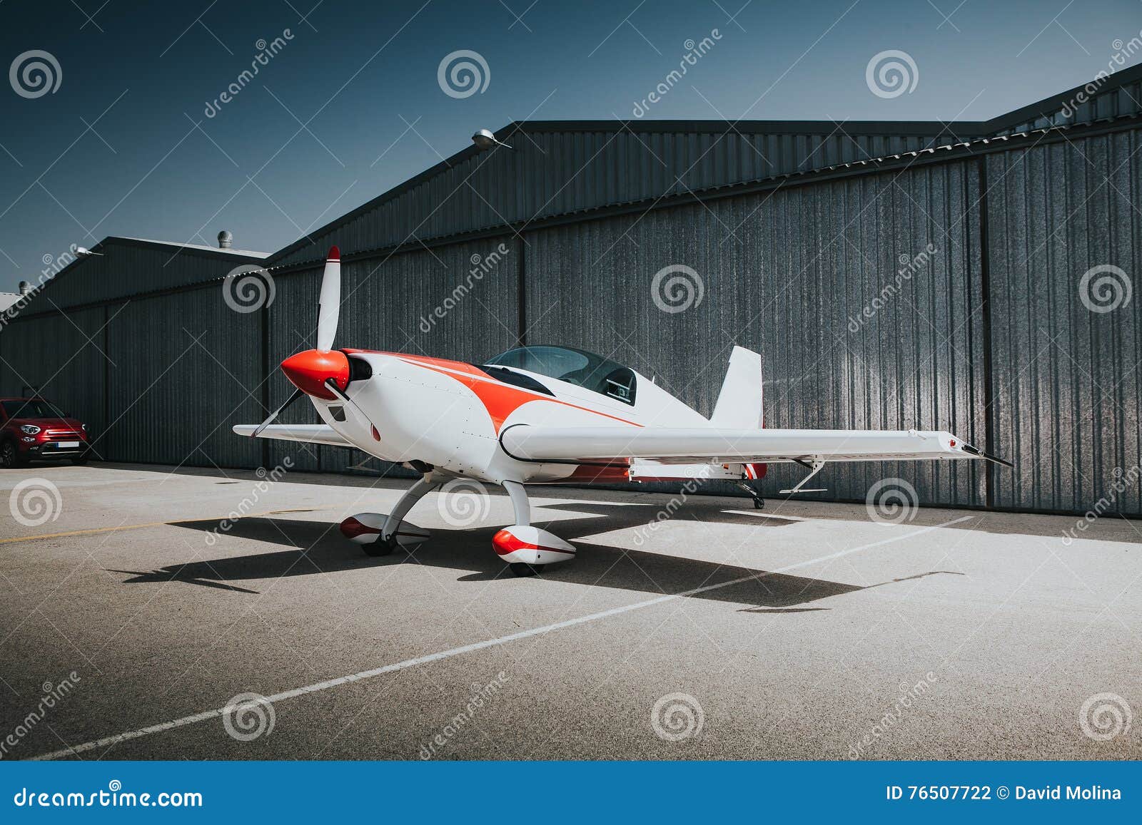 White and Red Small Plane at the Hangar S Door. Stock Photo - Image of ...