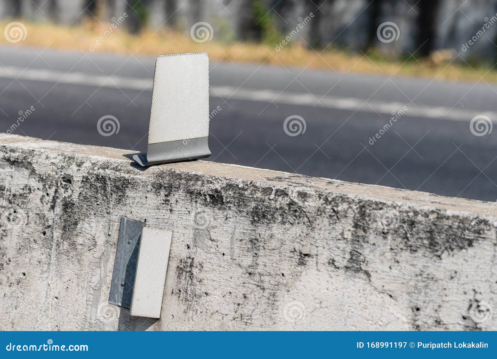 White Reflectors on the Concrete Road Barrier Stock Image - Image of ...