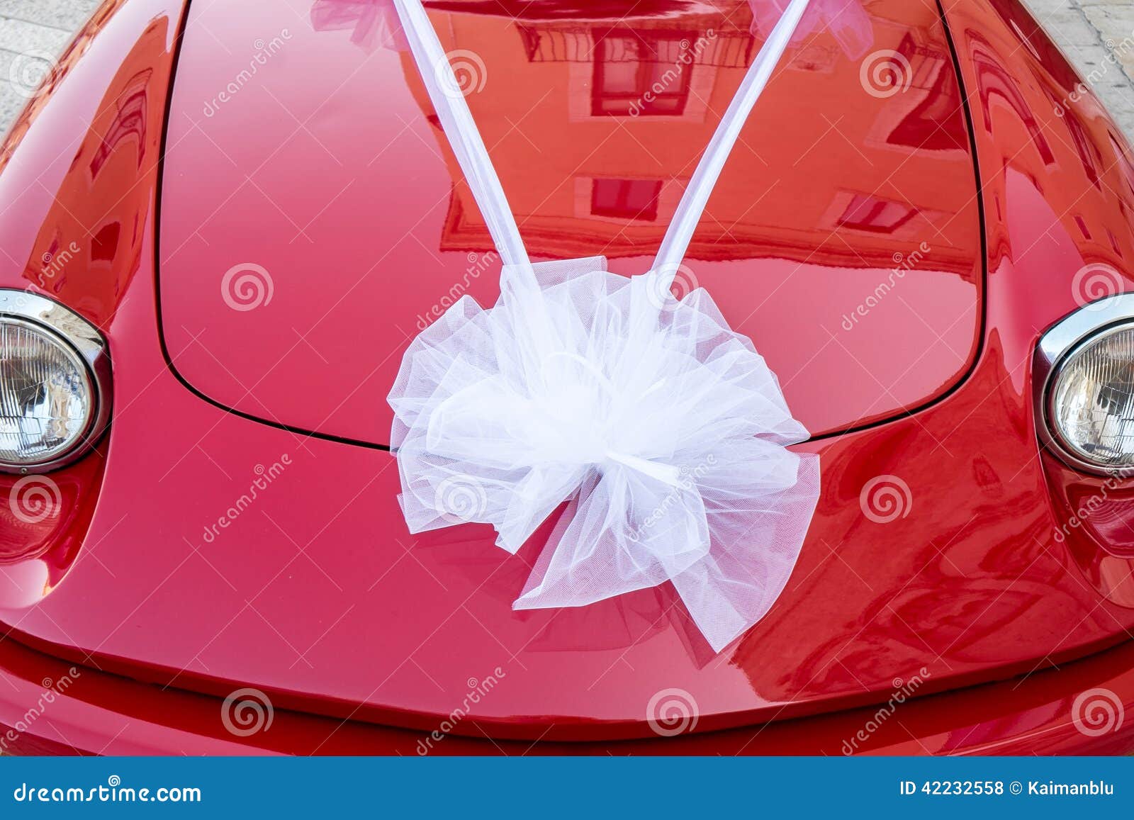 White ribbon on a red car stock photo. Image of wedding - 42232558
