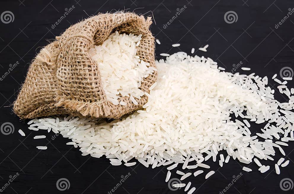 White Rice in a Bag on a Black Background. Stock Photo - Image of white ...