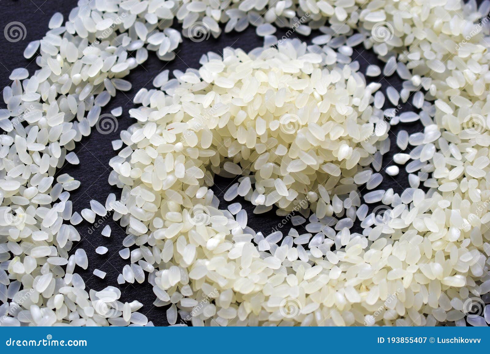 White Rice Curled into a Curl on a Black Background Stock Image - Image ...