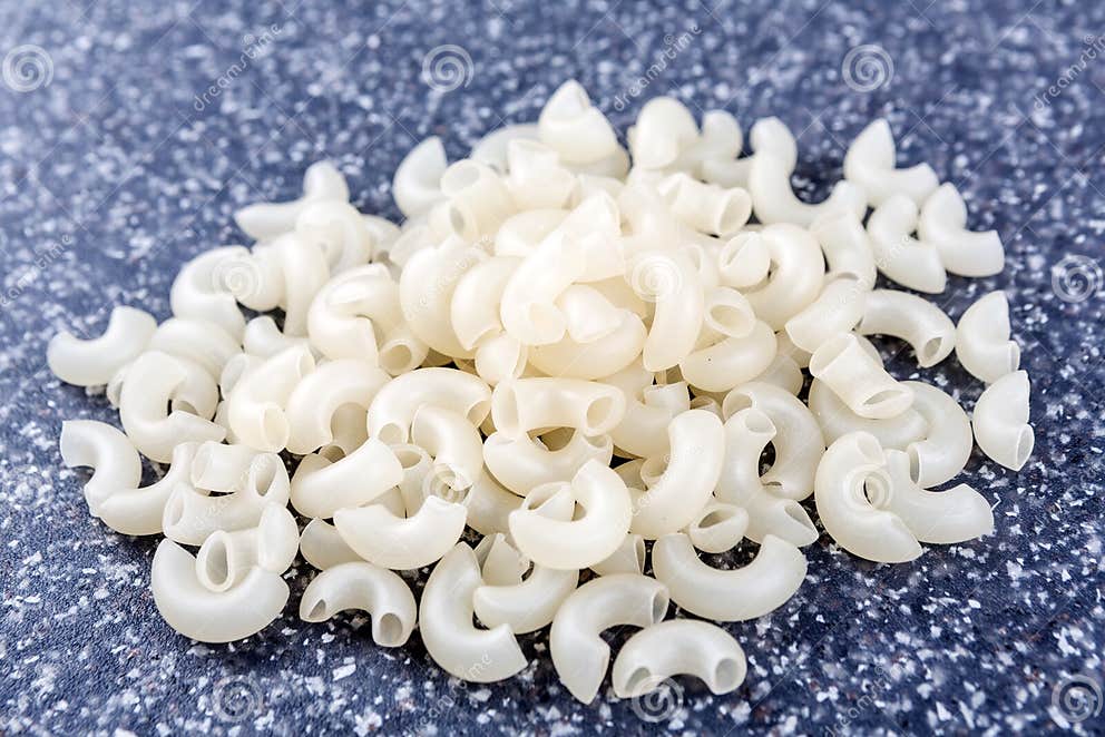 White rice elbow macaroni stock image. Image of food - 83175447