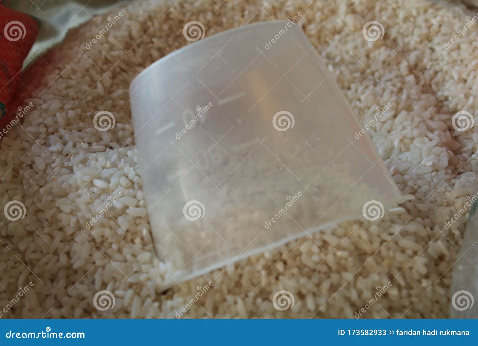 White Rice with Measured daily Dose in the Plastic Cup Stock Image ...