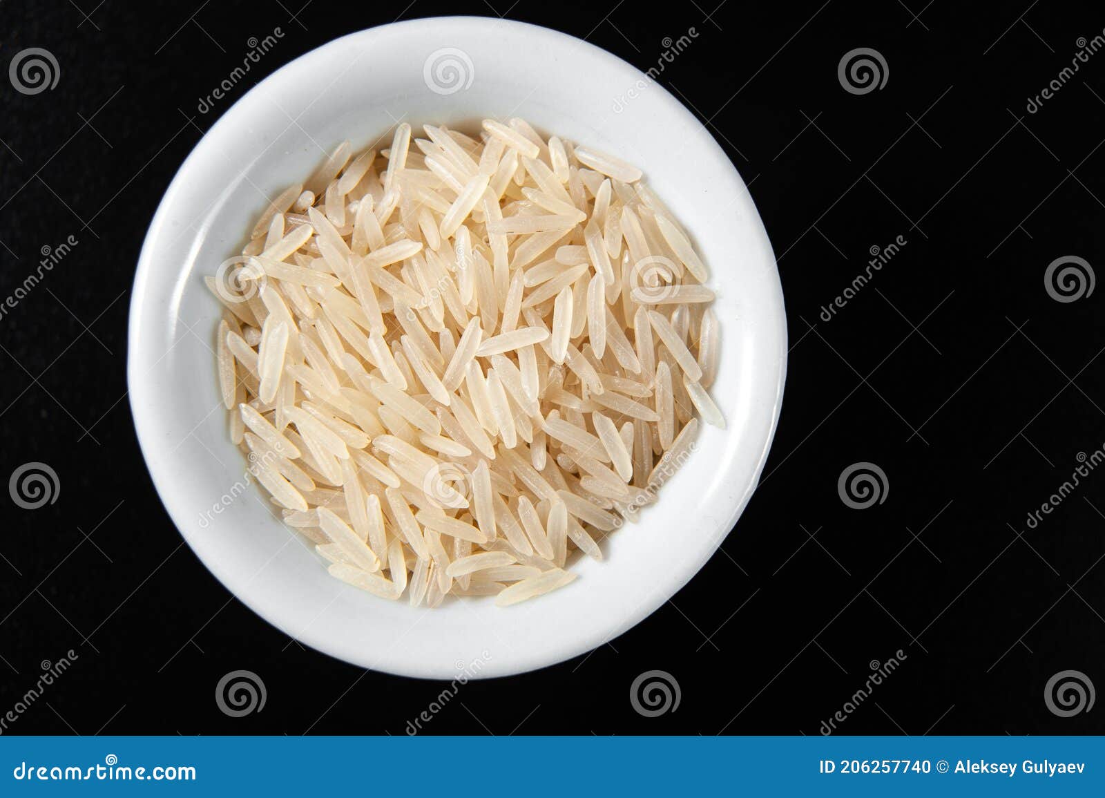 White Rice in a Plate on a Black Background, Macro Photograph. View ...