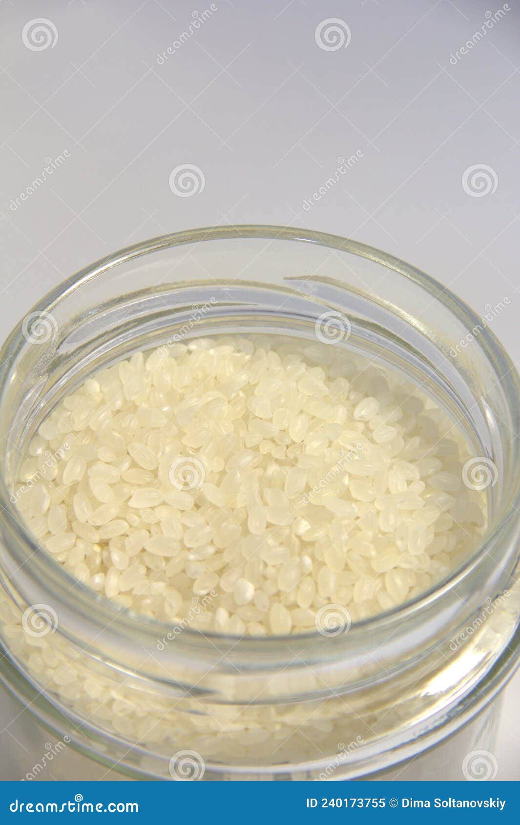 White Rice in a Transparent Jar. on a White Background. Vertical. Stock ...