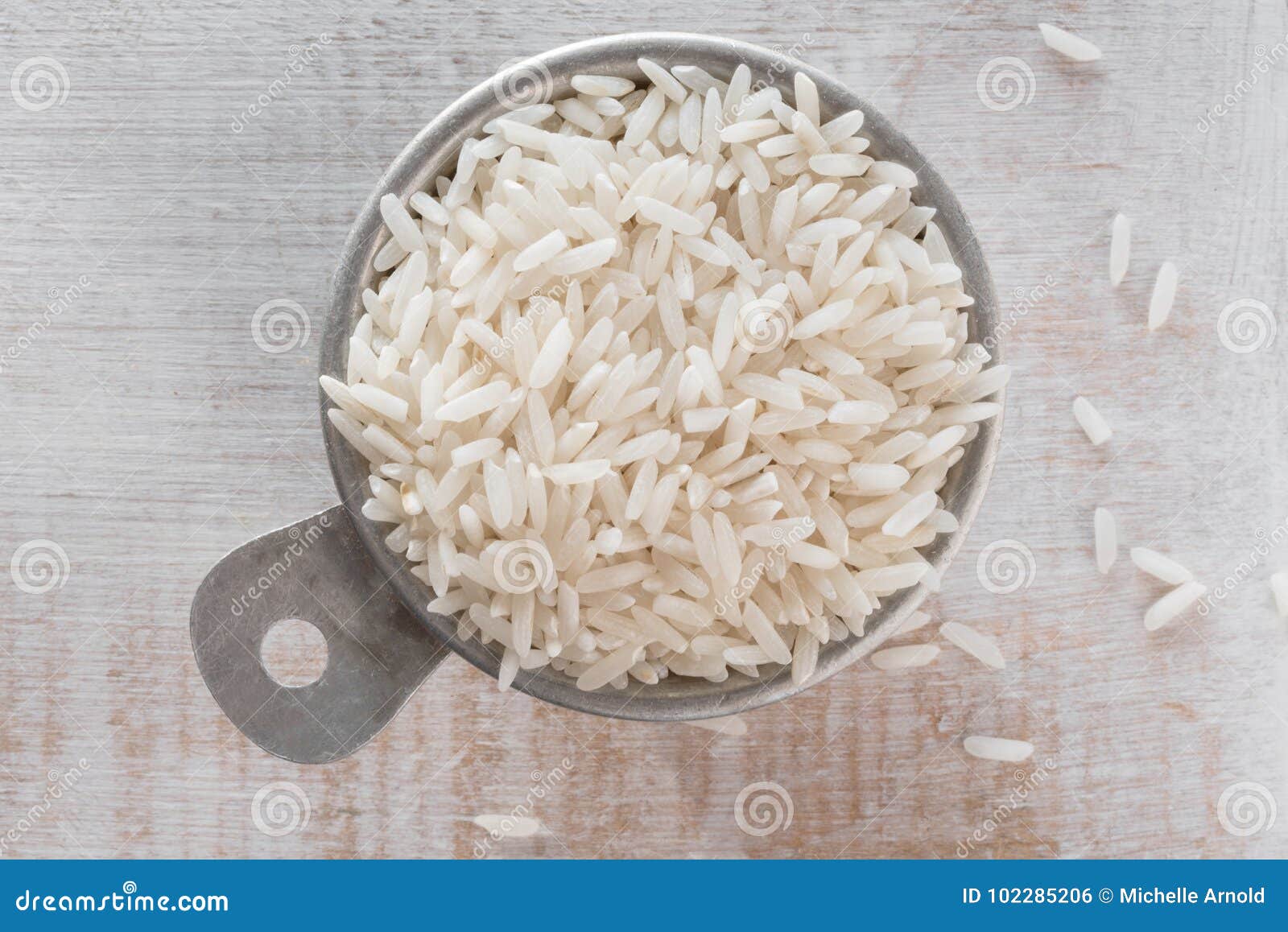 Uncooked White Rice in a Measuring Cup Stock Photo - Image of space ...