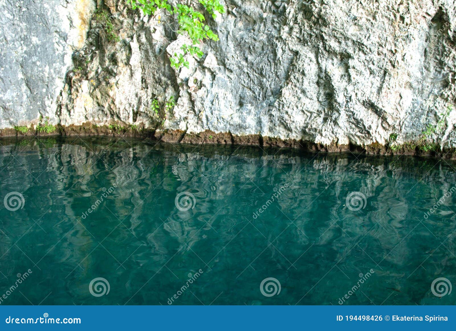 White rock and blue water stock photo. Image of outdoor - 194498426