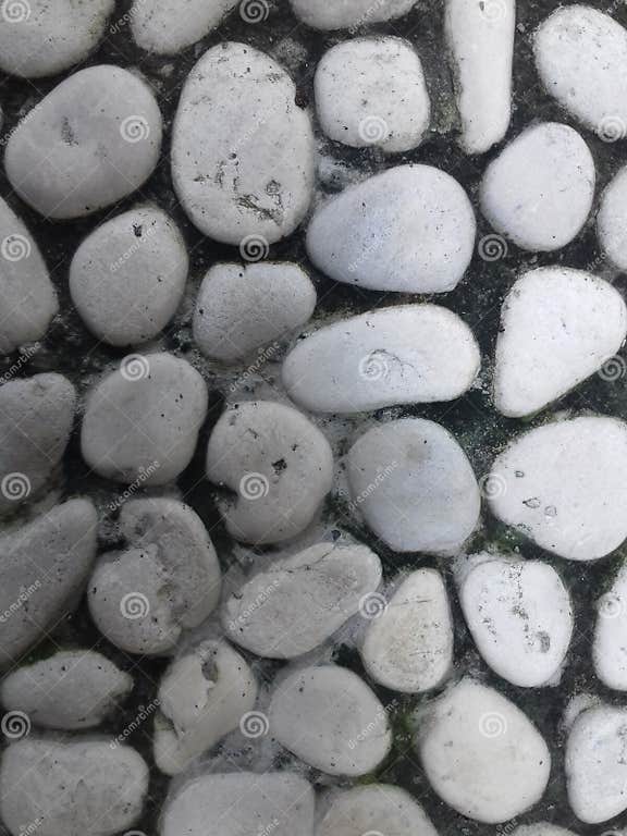 White rock lined up stock image. Image of soil, asphalt - 209547301