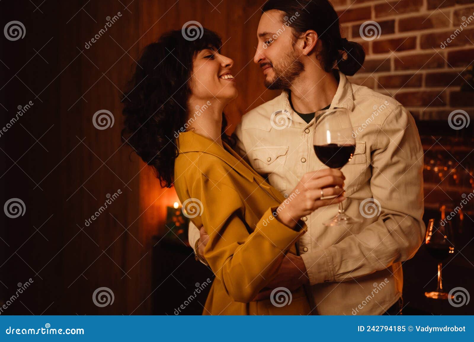 White Romantic Couple Dancing while Drinking Wine at Home Stock Image ...