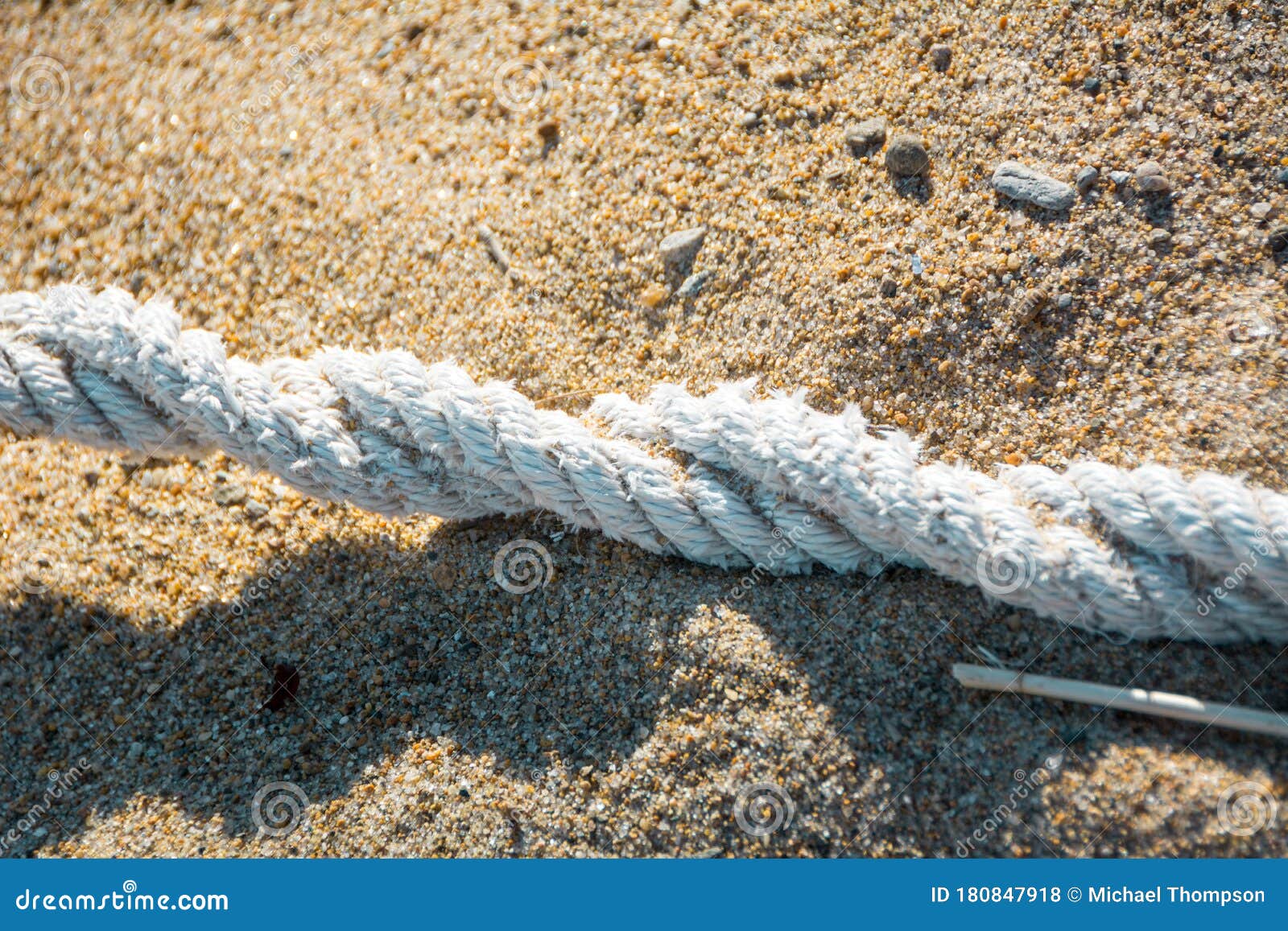 White Rope on Sandy Beach stock photo. Image of nautical - 180847918