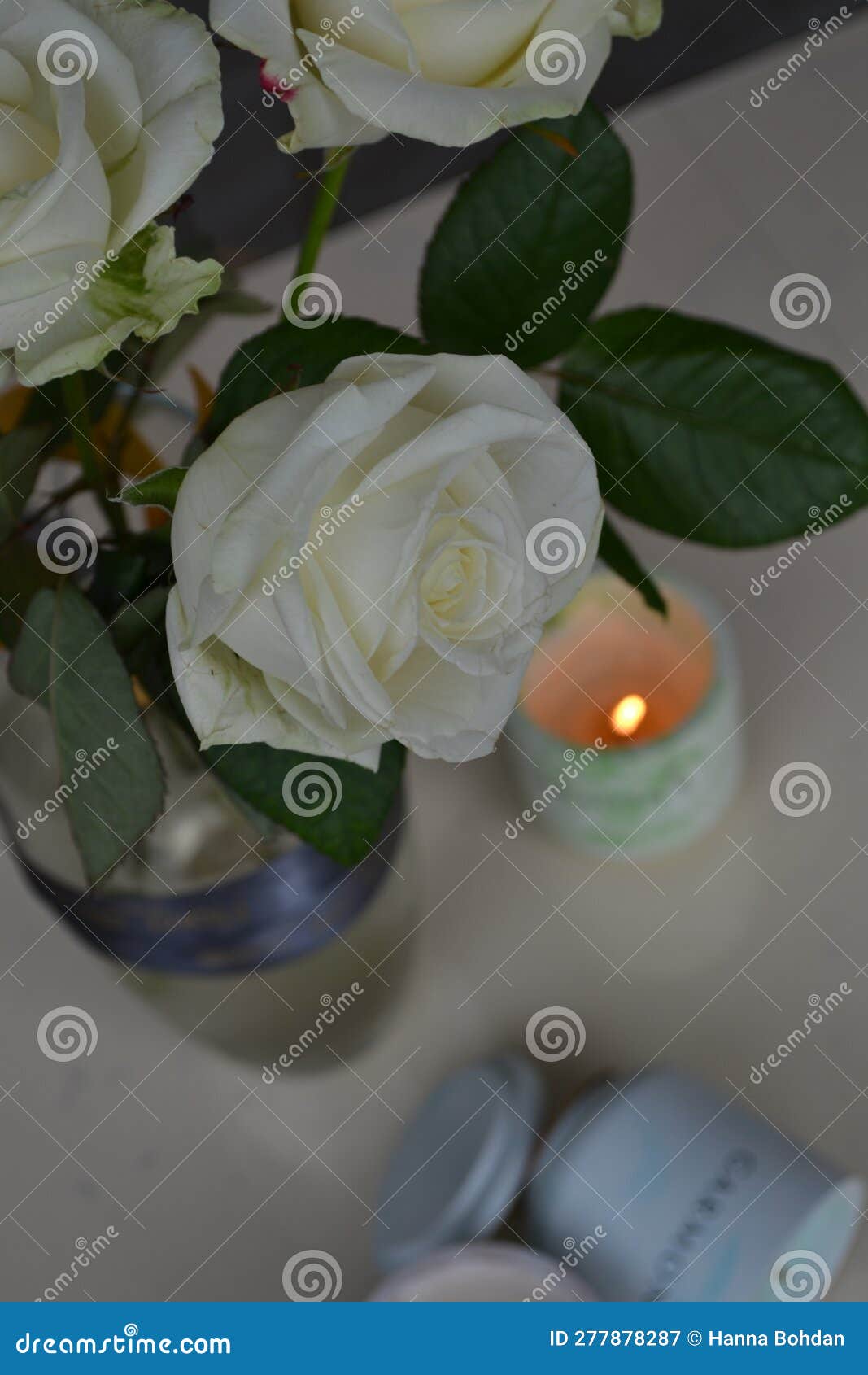 White Roses and a Lit Candle Stock Image - Image of produce, table ...